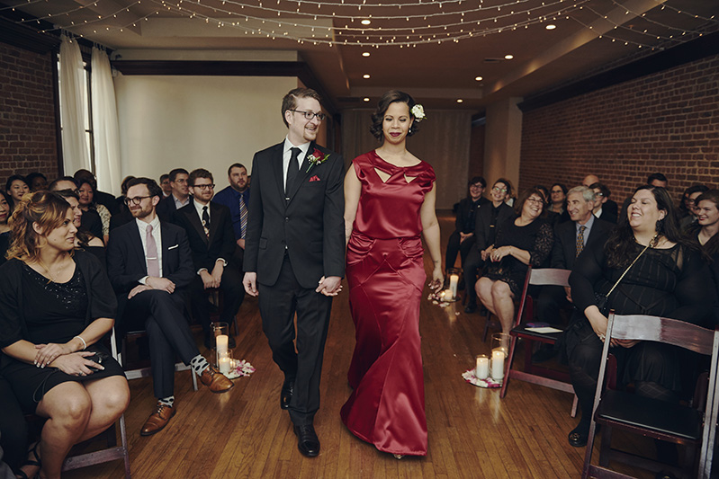 bride and groom walking down the isle together