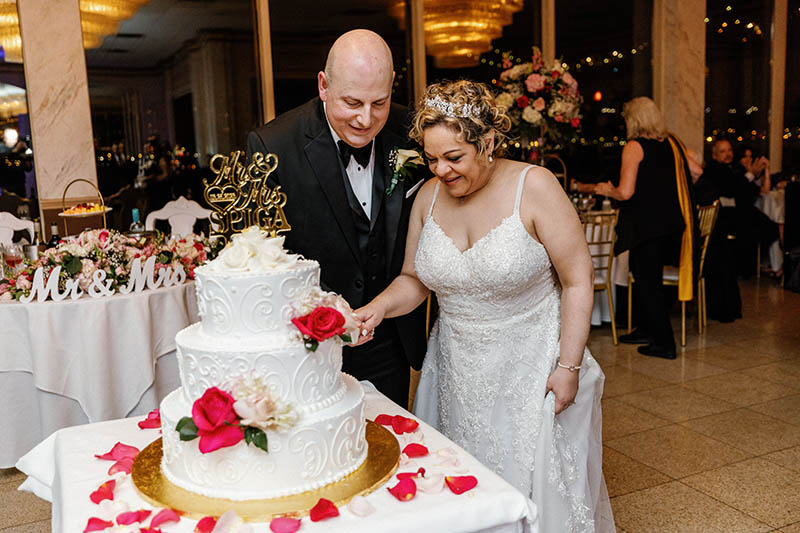 Bride and groom cut the cake