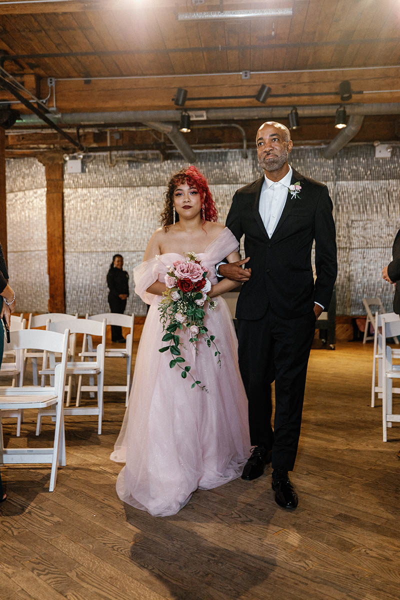 Bride walking down the aisle with father